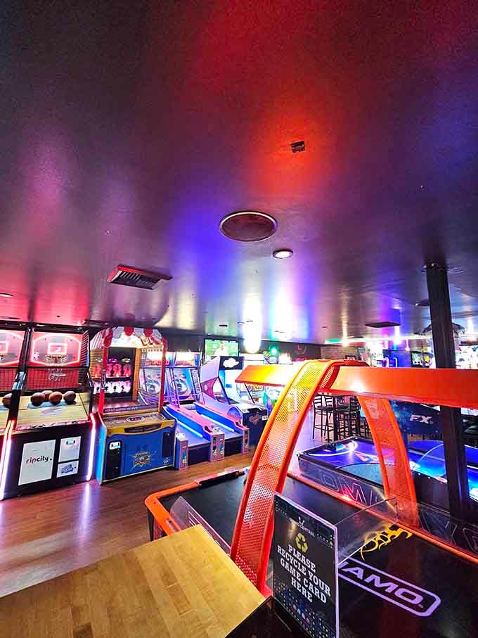 Neon arcade games glow like a carnival came indoors, bringing back memories of quarters and high score glory.