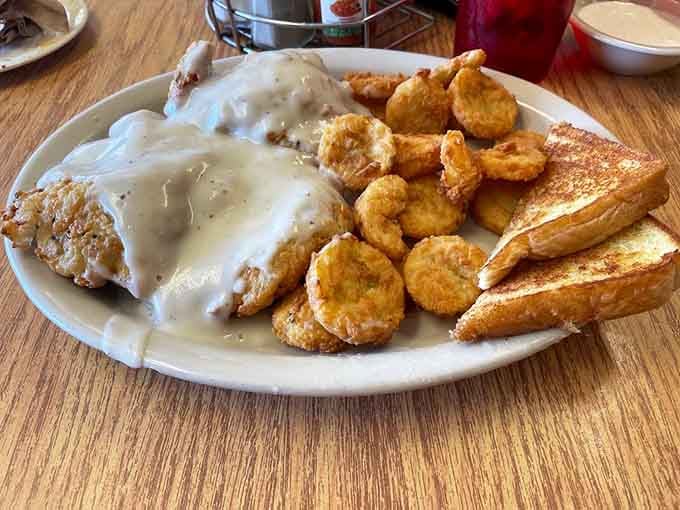 Two pieces of chicken fried steak smothered in peppery gravy make portion control seem like a silly modern concept.