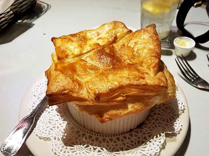 Chicken pot pie with a puff pastry crown that rises to the occasion, literally and figuratively speaking.
