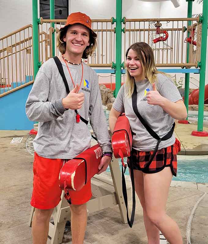 Friendly lifeguards keep watch over the aquatic action, making safety look surprisingly cool with their rescue gear swagger.