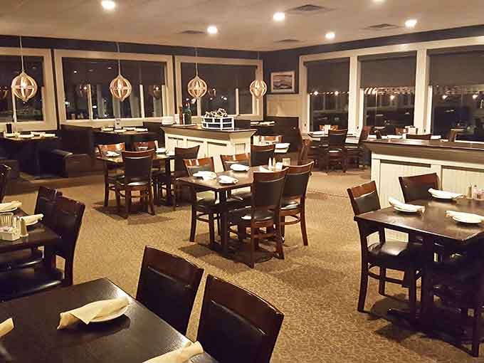 Evening ambiance transforms the dining room into an intimate space where celebrations feel extra special with lake views.