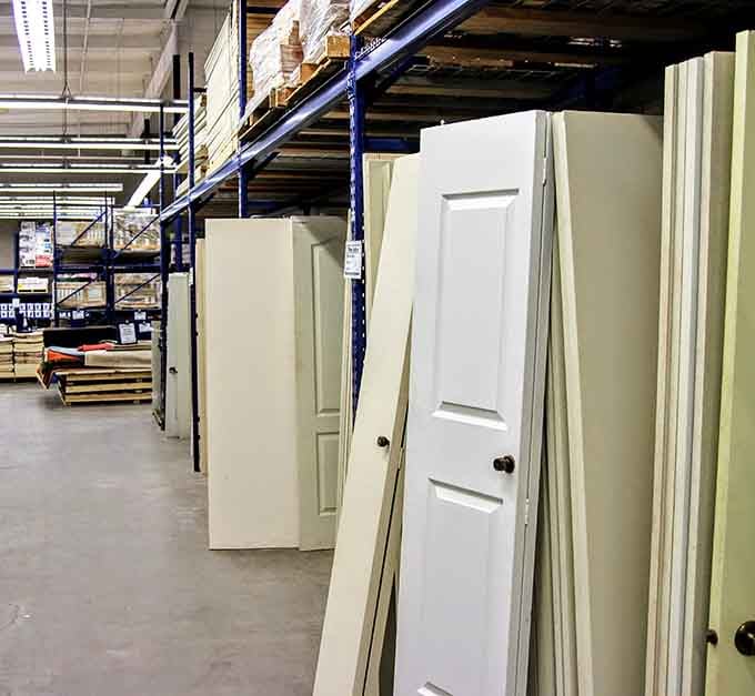 Interior doors standing tall, each one a blank canvas waiting to open into someone's newly renovated space.