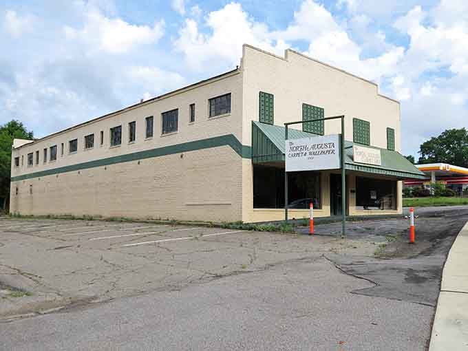 This abandoned commercial building sits empty and forlorn, its faded signage advertising services nobody in Hamburg needs anymore, if they ever did.