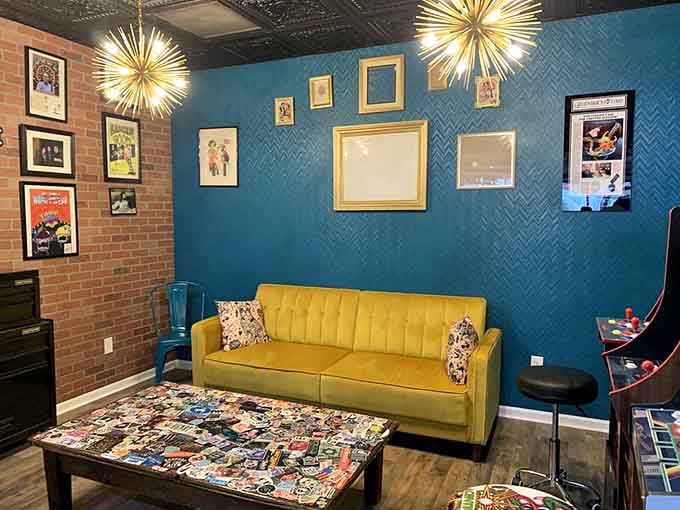 A yellow couch and starburst chandeliers create a lounge vibe that says stay awhile, sugar rush encouraged.