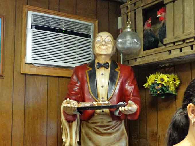 The butler statue and roosters create quirky character that feels earned over time, not purchased from a decorator.