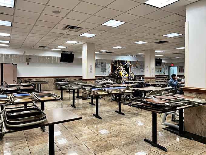 Rows of tables await hungry visitors, offering simple seating where the only distraction should be the incredible food before you.
