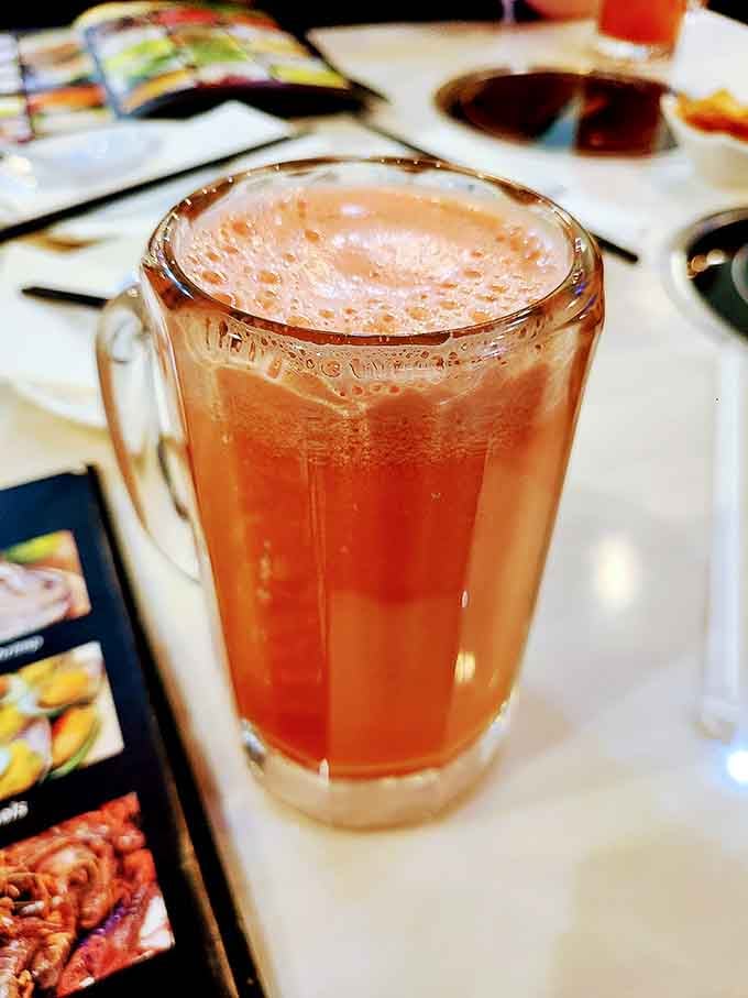 That peachy-pink beverage looks refreshing enough to make you forget you're about to eat your body weight in sushi.