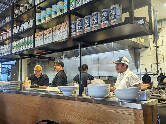 Watch the culinary team work their morning magic in this open kitchen where every plate gets assembled with visible care.
