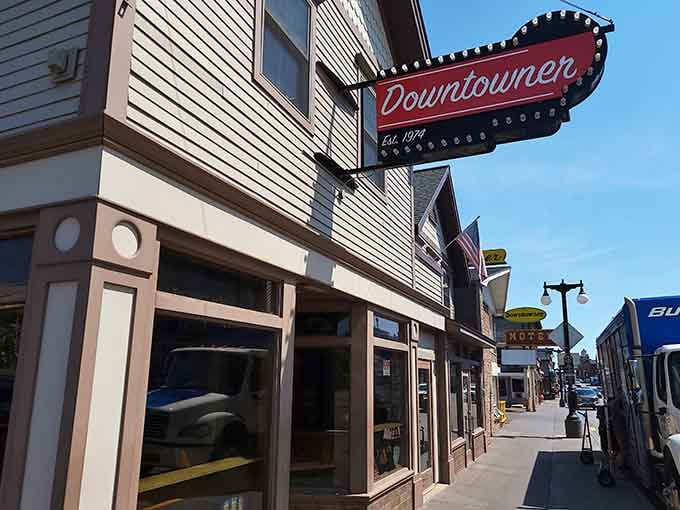 The Downtowner's vintage sign promises the kind of local atmosphere that chain bars can only dream about.