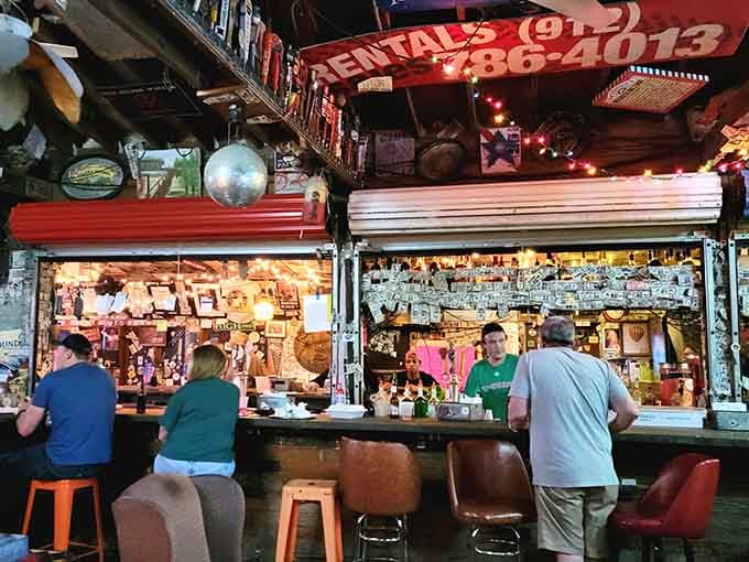 The bar area where dollar bills cover the floor and sports play on every screen.