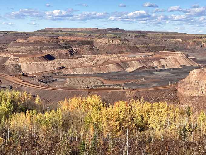 Fall foliage surrounding an active mine creates a uniquely Minnesota moment you won't find anywhere else on earth.
