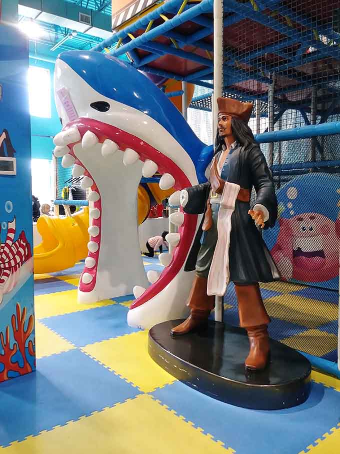 A pirate statue standing guard, because every ocean adventure needs a swashbuckler watching over the proceedings nearby.