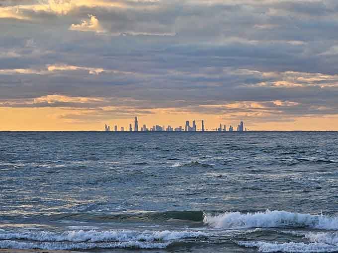 Sunset over the lake with Chicago's towers silhouetted like a distant dream on the horizon.