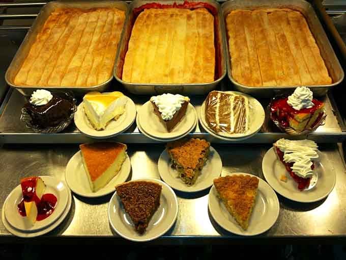 The dessert display that makes choosing just one slice feel like an impossible life decision requiring serious contemplation.