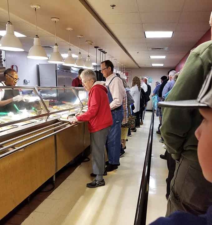The cafeteria line stretches with hungry folks making those delicious decisions that define the entire dining experience ahead.