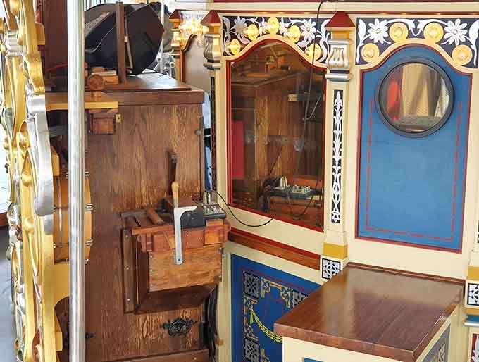 The vintage band organ provides the soundtrack, playing cheerful melodies that sound exactly like happiness should.