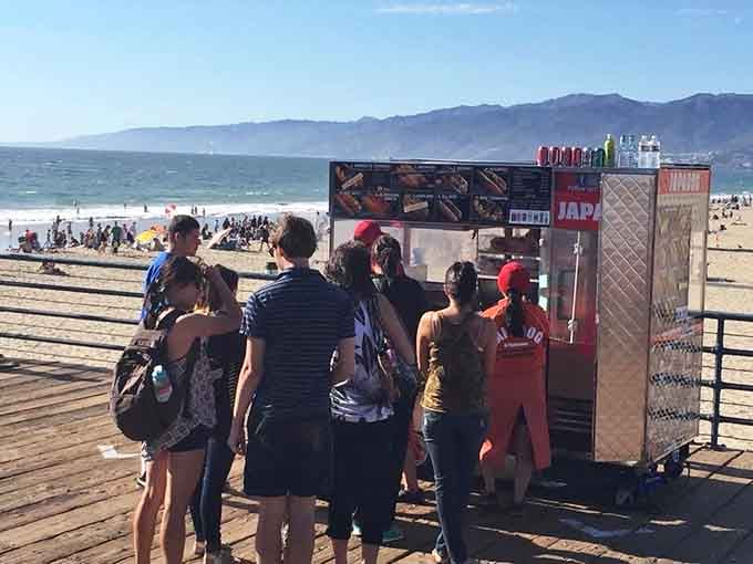 The line forms because word spreads fast when something this good lands on the pier.