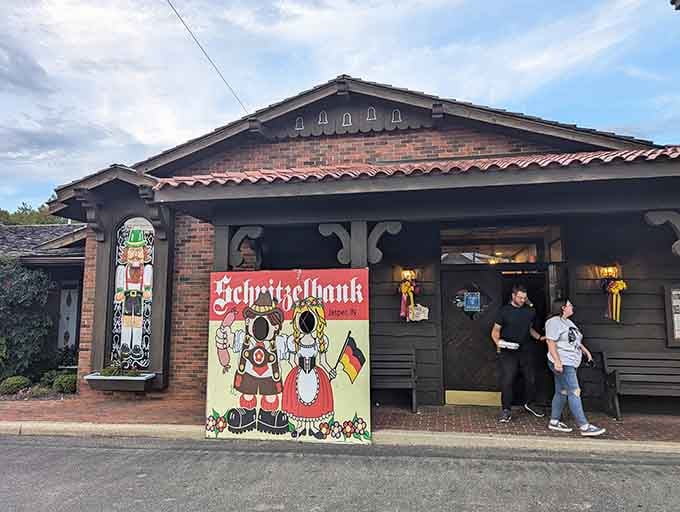 The Schnitzelbank's Bavarian cutout figures welcome you like old friends, promising authentic German food and good times inside.