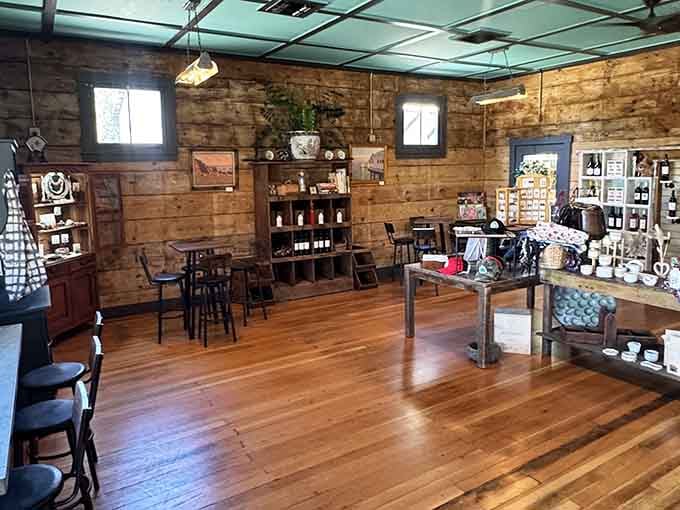 The interior shows off local wines and products on wooden shelves, making browsing almost as enjoyable as the eating part.