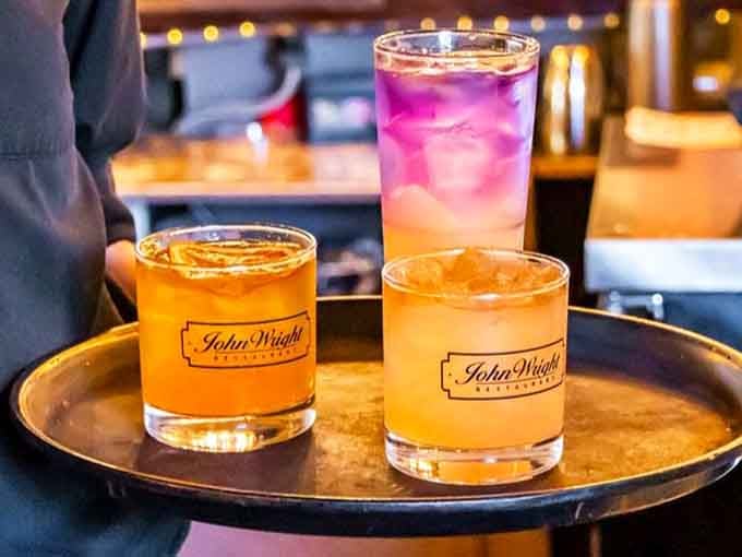 Cocktails served in proper glassware because presentation matters, even when you're just getting happily buzzed.