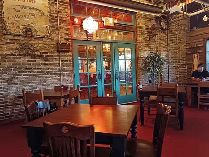 Exposed brick and warm lighting create an atmosphere that's equal parts cozy cantina and neighborhood gathering spot.