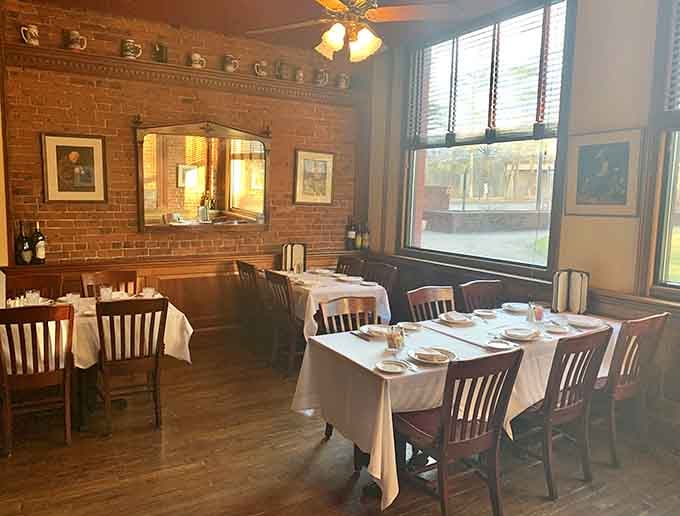 Another angle of the inviting dining room, where comfortable seating and warm lighting set the stage for memorable meals.