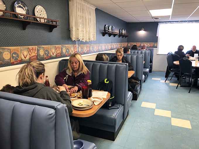 Real people enjoying real food in comfortable booths, which is exactly what breakfast should look like every single time.