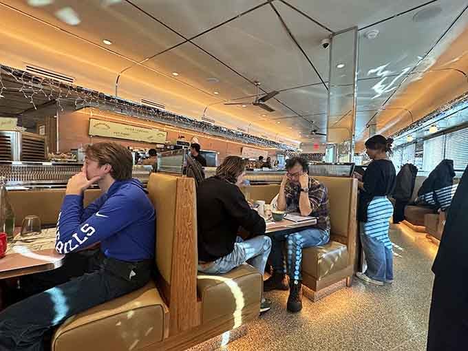 Real people enjoying real food in real booths&mdash;no influencers required, just appetites and good taste.