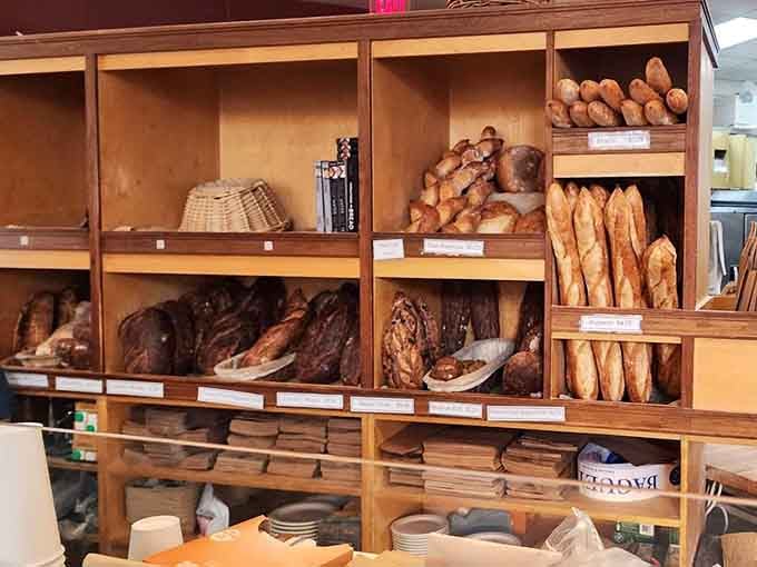 Wooden shelves holding more carbohydrate treasures than a French bakery's wildest dreams could conjure.