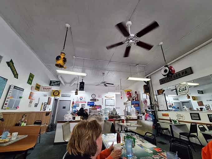 Ceiling fans, vintage memorabilia, and friendly faces make this dining room feel like coming home for supper.