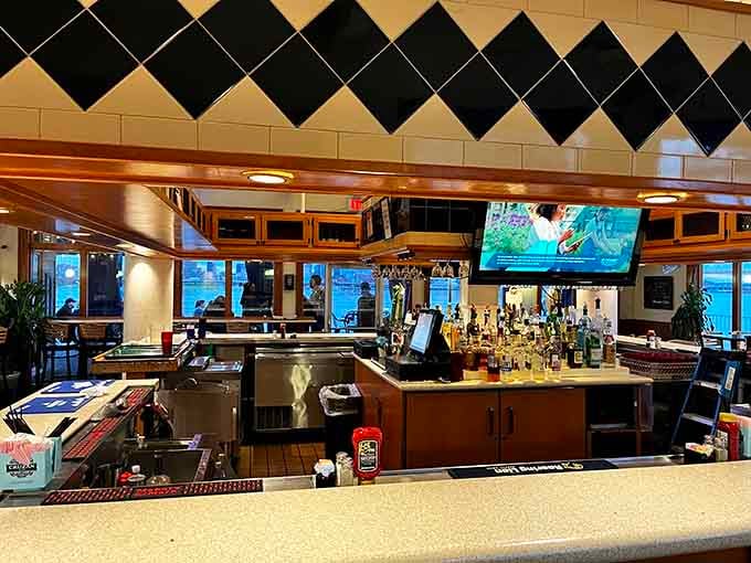 The well-stocked bar with diamond-pattern tile backsplash sets a retro-cool tone that's pure waterfront sophistication.