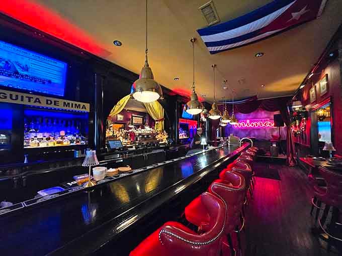 The bar glows with red lighting and promises of rum-fueled adventures, all without leaving your barstool.