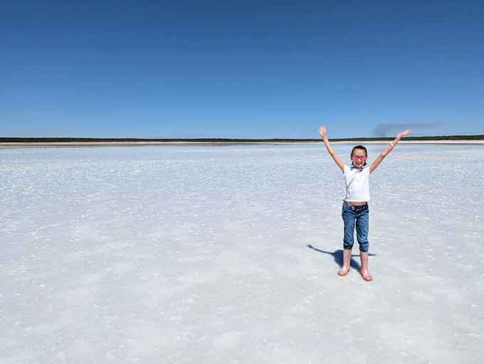 Pure joy captured in a kid who just discovered they're standing on millions of tons of actual salt.
