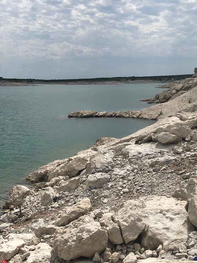 Rugged limestone formations along the shore prove nature's been doing abstract art for millions of years.