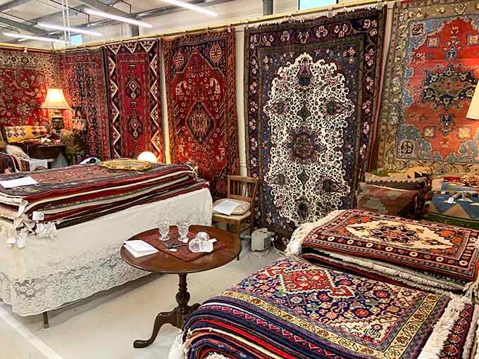 This stunning rug display transforms a simple booth into an exotic marketplace that could rival any international bazaar.