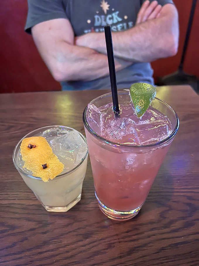 Two cocktails ready for their close-up, because drinking under disco balls and ornaments requires proper libations.