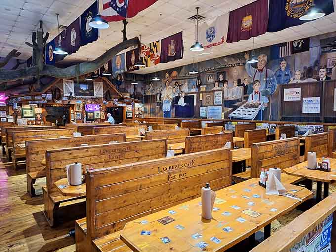 Wooden booths stretching into the distance under state flags remind you that good food brings people together from everywhere, always has.