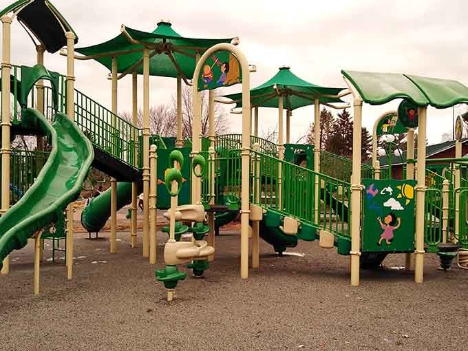 Playground equipment in cheerful green invites families to unplug and rediscover the joy of outdoor play.