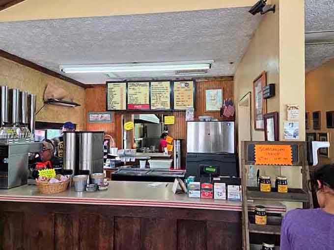 The counter area where orders are placed and breakfast dreams begin, complete with menu boards and friendly service.