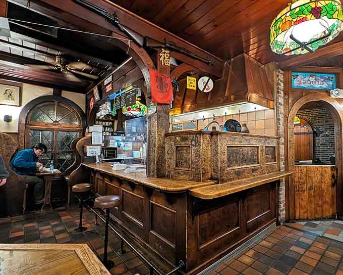 Counter seating where you can watch burger magic happen on vertical grills that defy modern cooking logic beautifully.