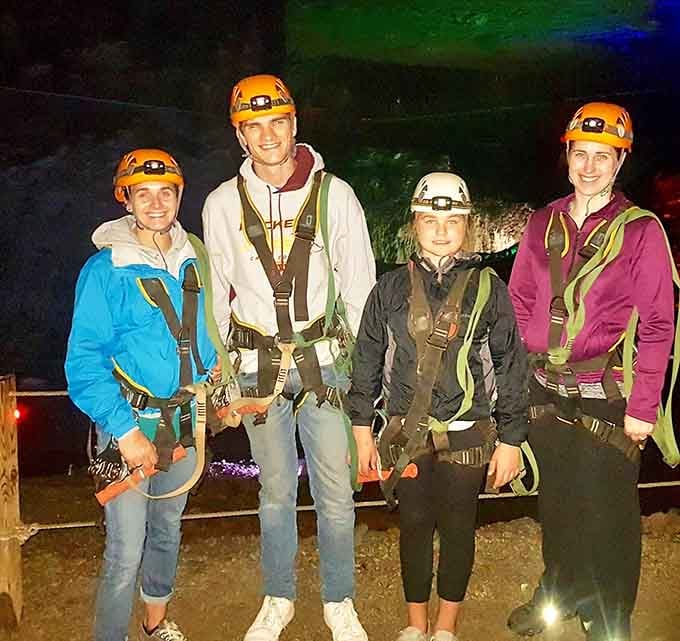 Happy adventurers ready to conquer the underground. Those helmets mean business, those smiles mean they know what's coming.