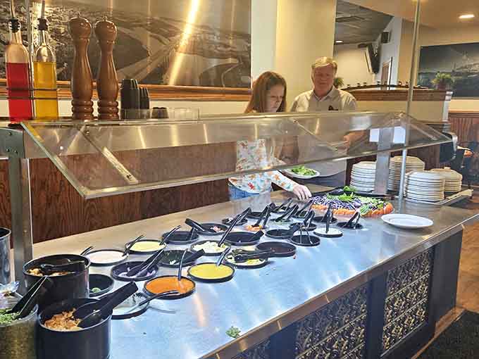 The salad bar setup lets you customize your meal exactly how you want it, no judgment included here.