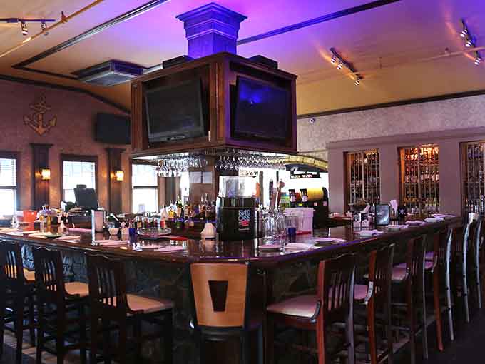 The bar stands ready to mix your favorite drink while fish swim overhead, creating the world's most entertaining happy hour.