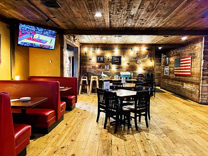 Red booths and rustic wood create that comfortable vibe where strangers become friends over shared baskets of chips.