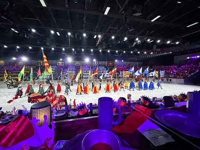 The full cast assembled in the sand arena delivers pageantry that would make halftime shows jealous everywhere.