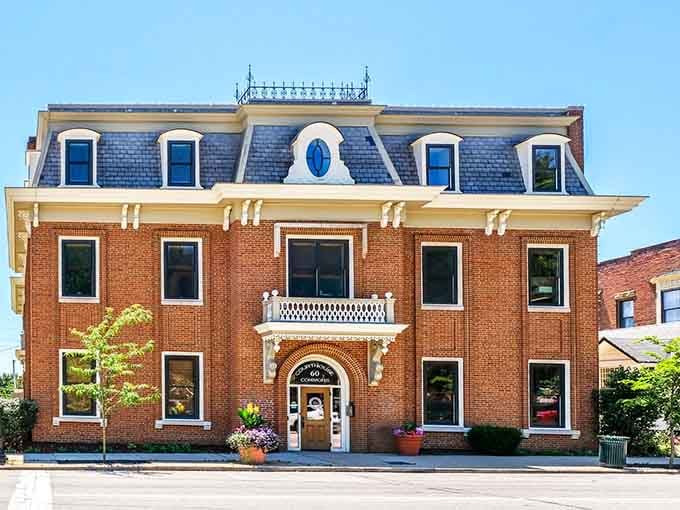 That mansard roof and ornate brickwork represent craftsmanship from an era when buildings were meant to impress.