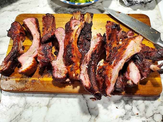 These ribs showcase the kind of smoke ring and bark that make pitmasters weep with envy and admiration.