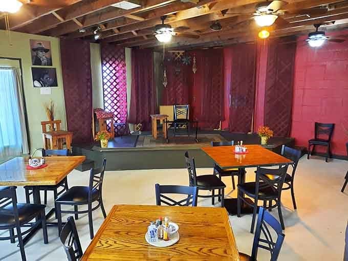 The performance area sits ready to host musicians who understand that good food deserves a soundtrack.