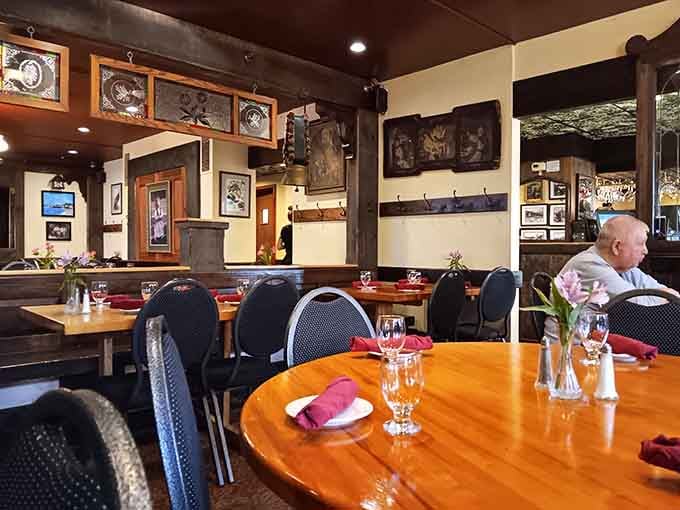 Fresh flowers on every table add a touch of elegance to the hearty comfort food experience unfolding here.