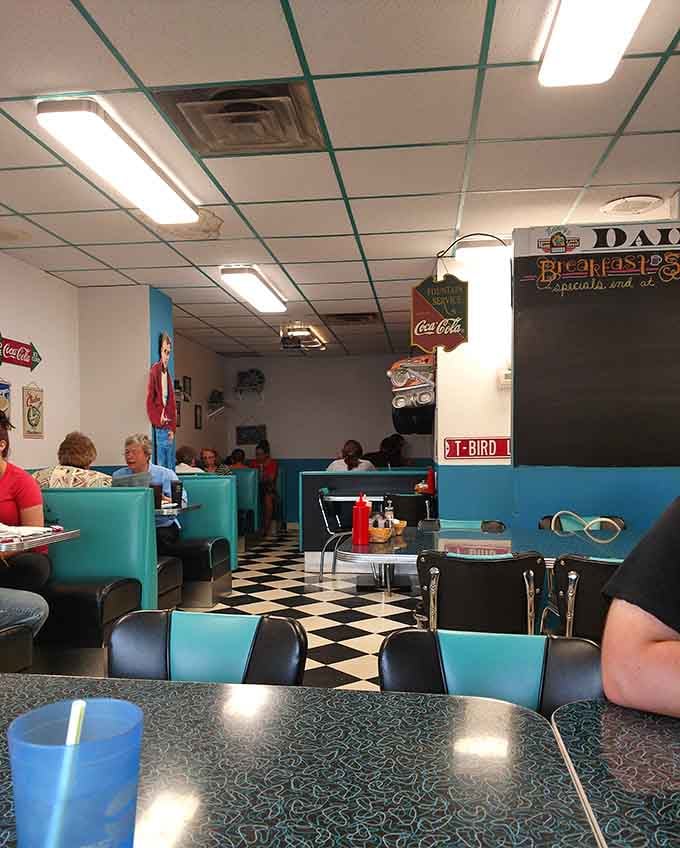 Vintage Coca-Cola signs and retro decor create an atmosphere where every meal feels like a special occasion celebration.